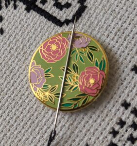 field of flowers needle minder