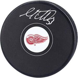 moritz seider detroit red wings autographed hockey puck - autographed nhl pucks