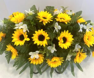 cemetery headstone saddle arrangement with yellow sunflowers and white daisies-grave decoration