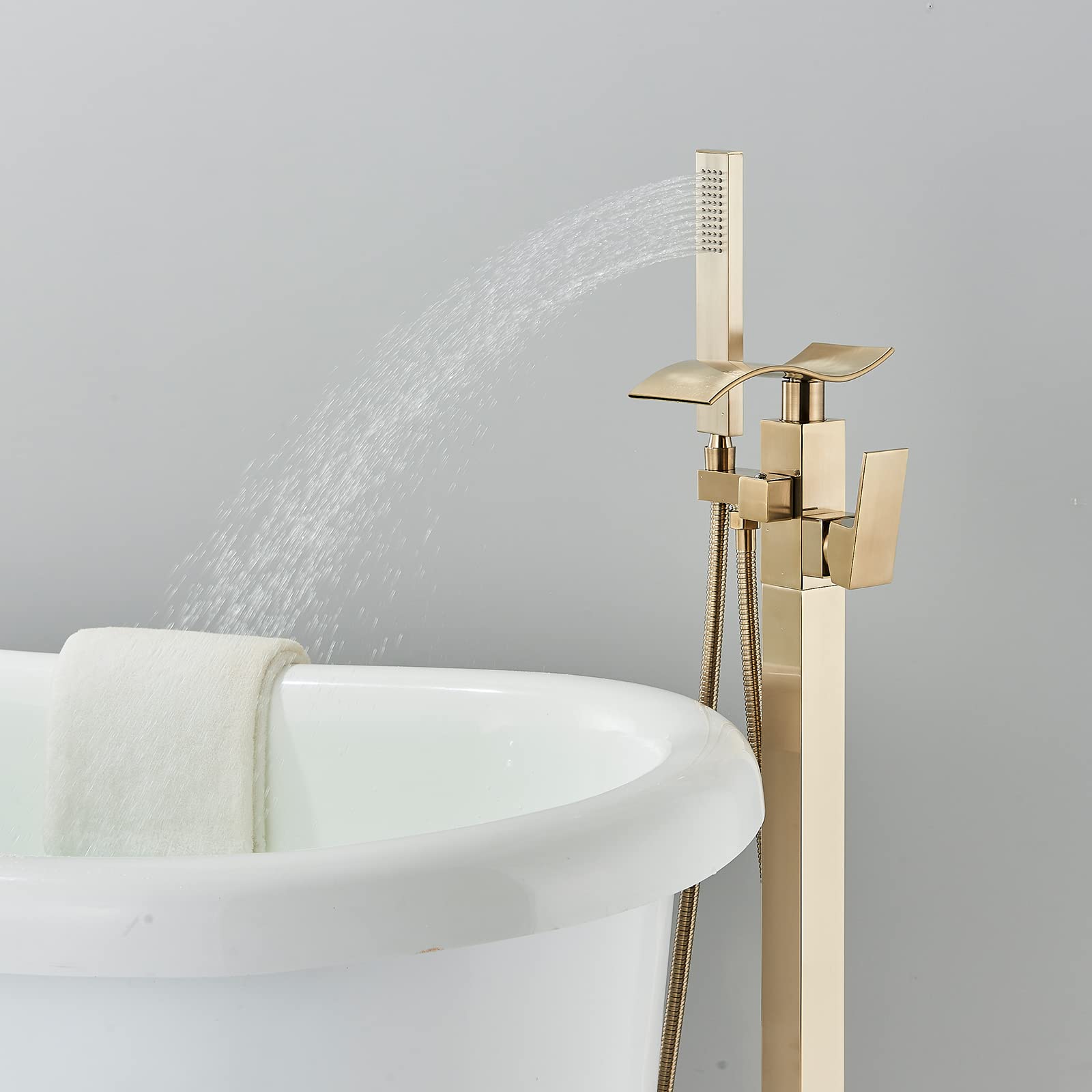 Gmusre Brushed Gold Floor Mounted Waterfall Tub Filler Freestanding Bathtub Faucet Brass Bathroom Single Handle with Shower Hand Spray and 360 Degree Swivel Spout