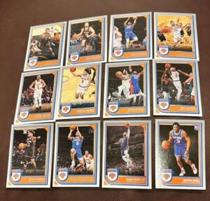 2022-23 panini nba hoops new york knicks team set includes rookies (hand collated) of 12 cards: #18 rj barrett #19 evan fournier #20 julius randle #21 obi toppin #22 kemba walker #23 quentin grimes #24 derrick rose #25 cam reddish #27 miles mcbride #28 im