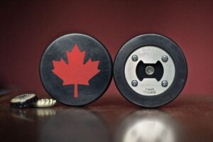 canadian maple leaf bottle opener, made from a real hockey puck