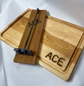 personalized miniature branding iron with cedar display board and branded carving board by sloan brands