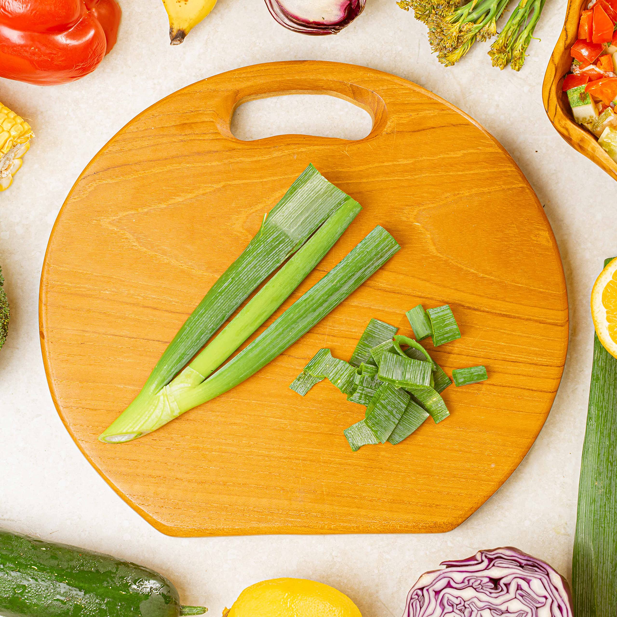 Rainforest Bowls 11.5"x10.6" Circular Javanese Teak Wood Cutting Board w/Handle- Ultra-Durable, Heavy Duty, Lasts Years w/Daily Use- Premium Custom Design Handcrafted by Indonesian Artisans