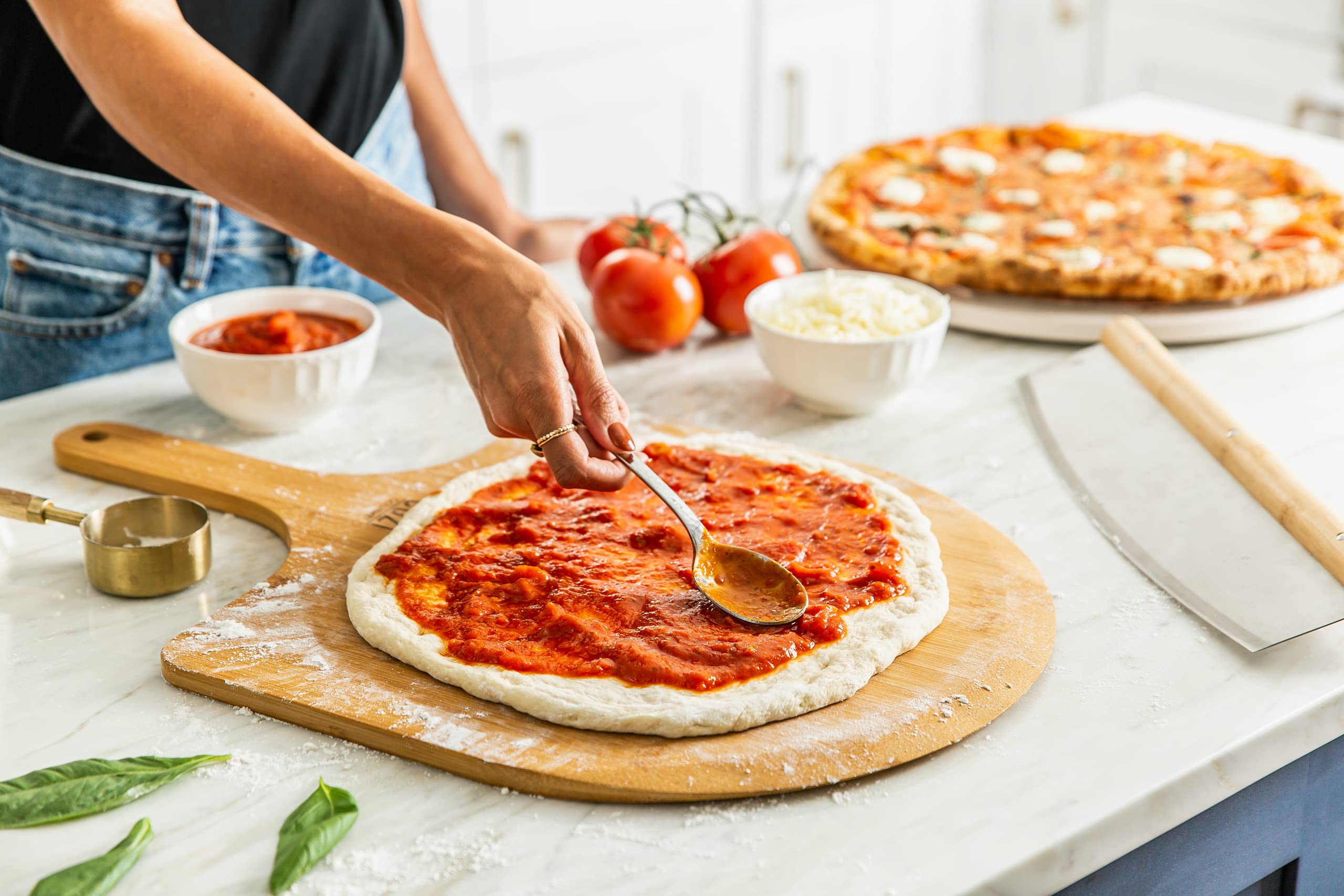 Cuzi Gourmet 4-Piece Large Pizza Stone Set - 13" Thermal Shock Resistant Cordierite Pizza Stone with Handle Rack, 19" Natural Bamboo Pizza Peel & Pizza Cutter - Large Baking Stone for Grill and Oven