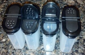 tupperware large spice shaker set of four. black seals