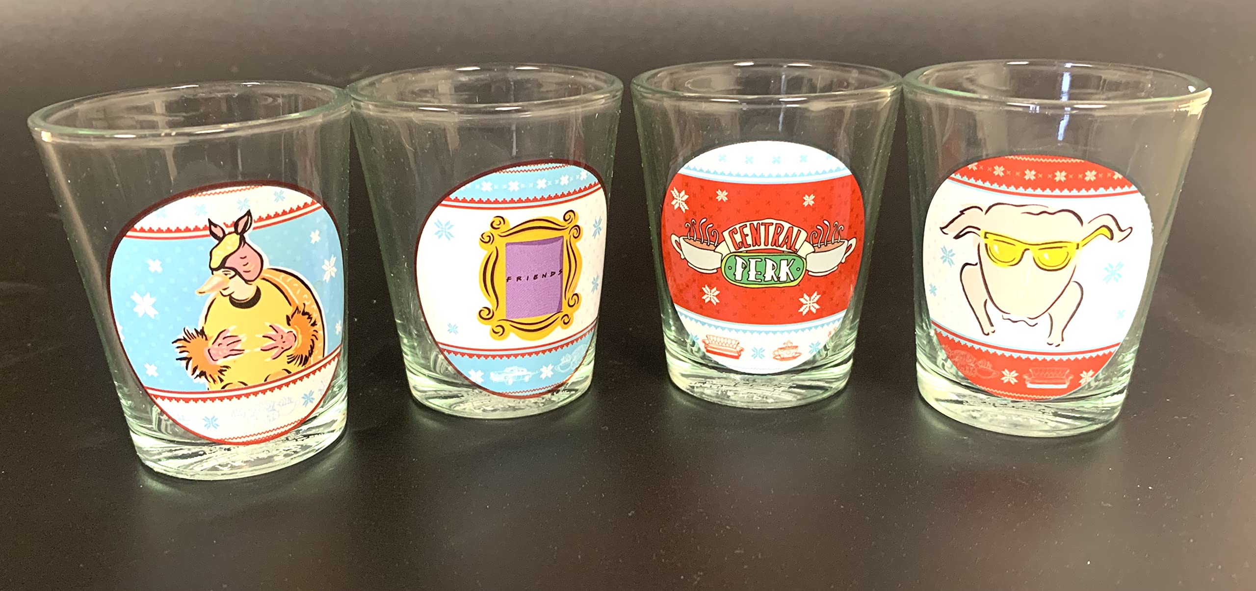 Friends The Television Series Set Of Four Shot Glasses! Featuring The Holiday Armadillo, The Thanksgiving Turkey, Central Perk Logo And Infamous Picture Frame! Fiends TV Show Inspired Glassware Set!