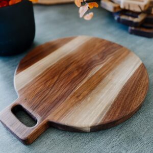 Round charcuterie serving board with handle, handmade in the USA with Walnut hardwood.