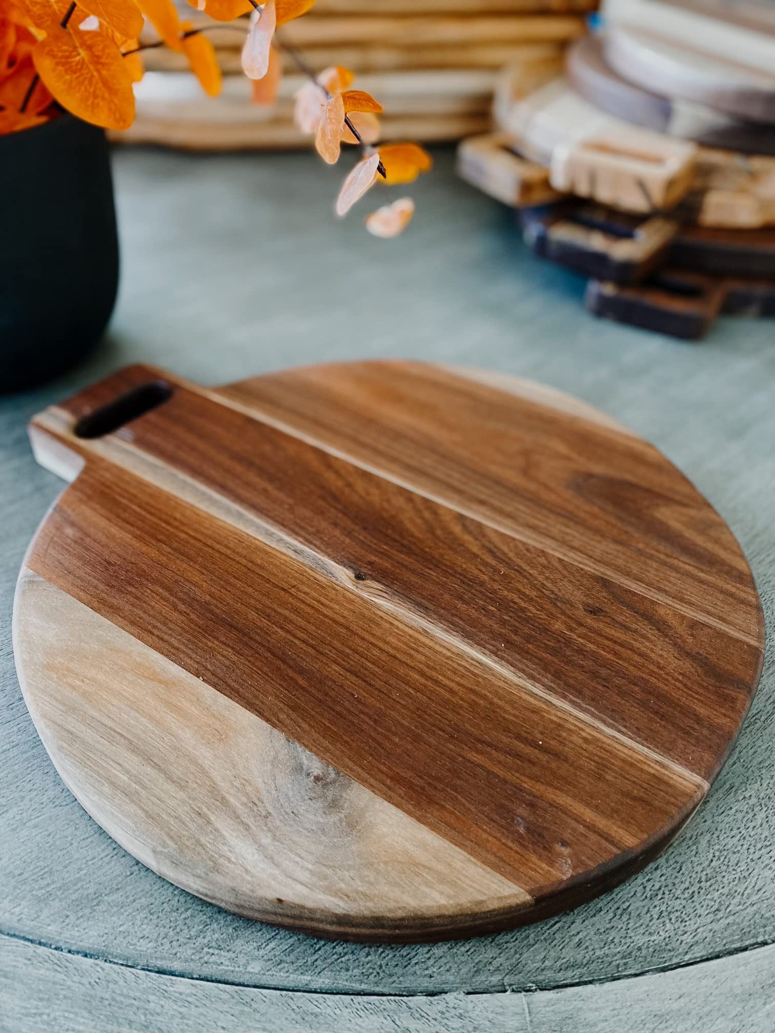 Round charcuterie serving board with handle, handmade in the USA with Walnut hardwood.