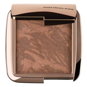 hourglass ambient lighting bronzer in radiant bronze light. highlighting bronzer for a natural sun-kissed glow. vegan and cruelty-free.