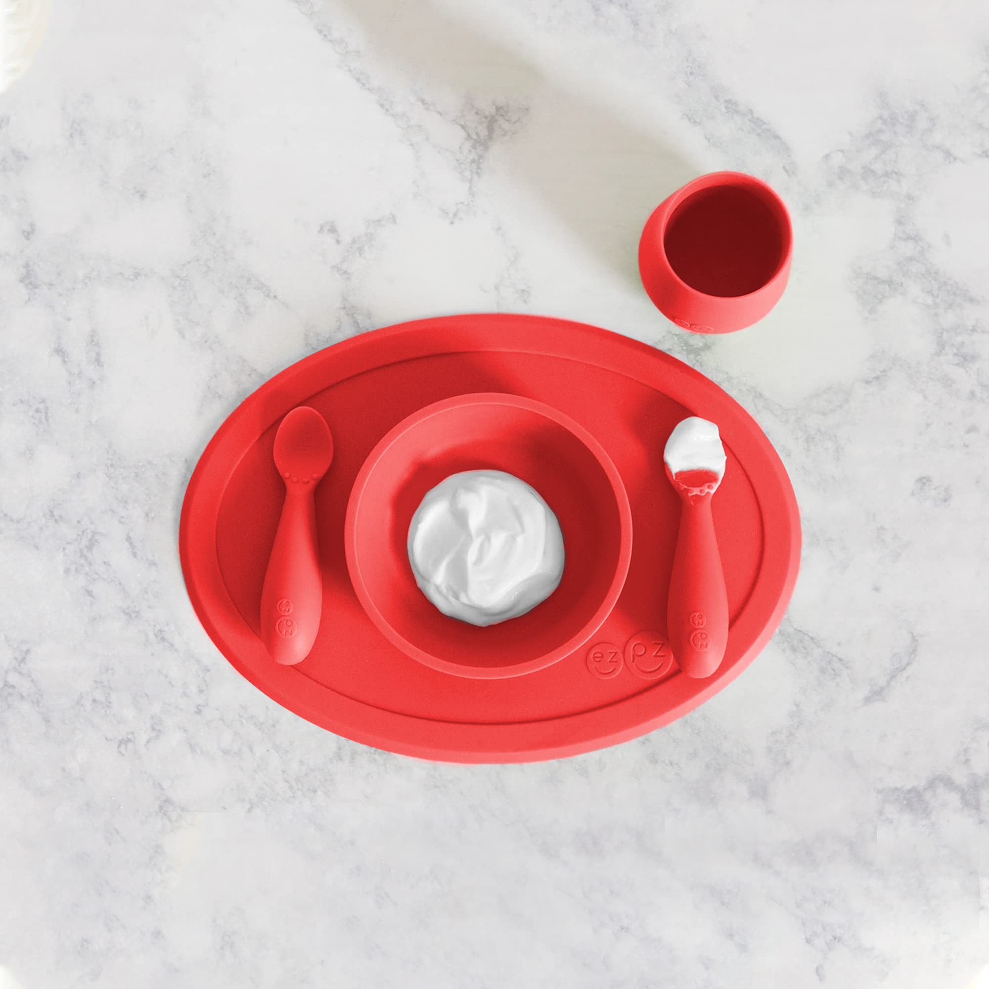 ezpz Tiny Collection Set (Coral) - 100% Silicone Cup, Spoon & Bowl with Built-in Placemat for First Foods + Baby Led Weaning + Purees - Designed by a Pediatric Feeding Specialist - 6 Months+