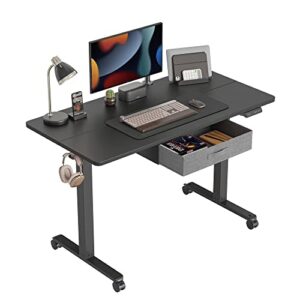 cubicubi 48 x 24 inch standing desk with drawer, electric stand up adjustable height electric stand up desk, sit stand home office desk, ergonomic workstation black steel frame/black tabletop