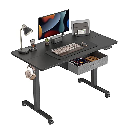 CubiCubi 48 x 24 Inch Standing Desk with Drawer, Electric Stand up Adjustable Height Electric Stand up Desk, Sit Stand Home Office Desk, Ergonomic Workstation Black Steel Frame/Black Tabletop