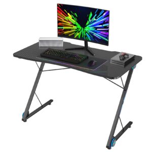 tangkula gaming computer desk, z-shaped home office computer table with led lights & large carbon fiber surface, ergonomic gamer workstation, writing desk for home office