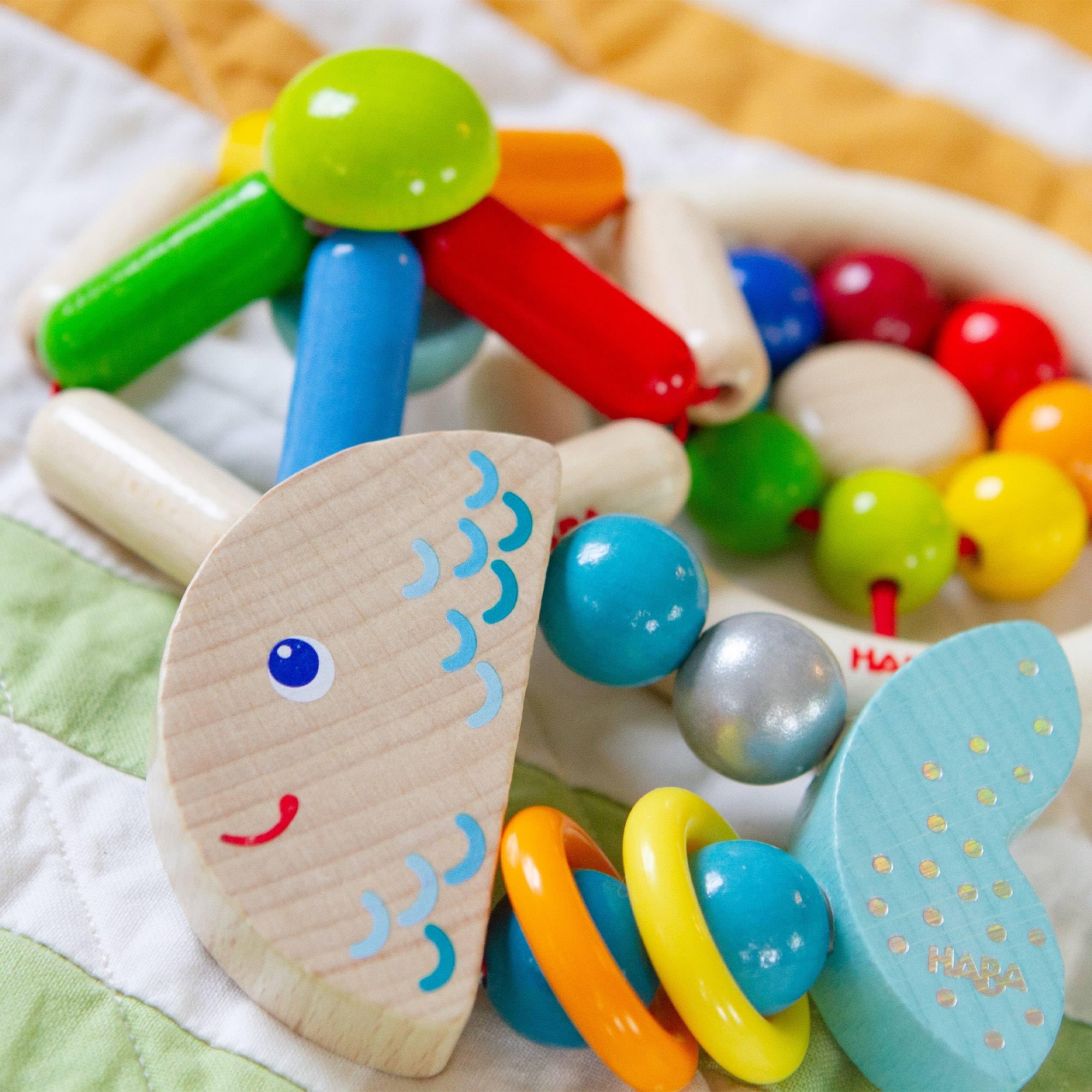 HABA Rattlefish Wooden Clutching Toy with Plastic Rings (Made in Germany)…