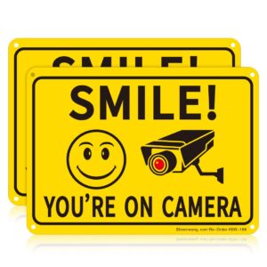 sheenwang 2-pack smile you’re on camera sign, video surveillance signs outdoor, uv printed .040 mil rust free aluminum 10 x 7 in, security camera sign for home, business, driveway alert, cctv