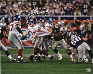 eli manning new york giants autographed 16" x 20" super bowl xlii escaping tackle photograph - autographed nfl photos