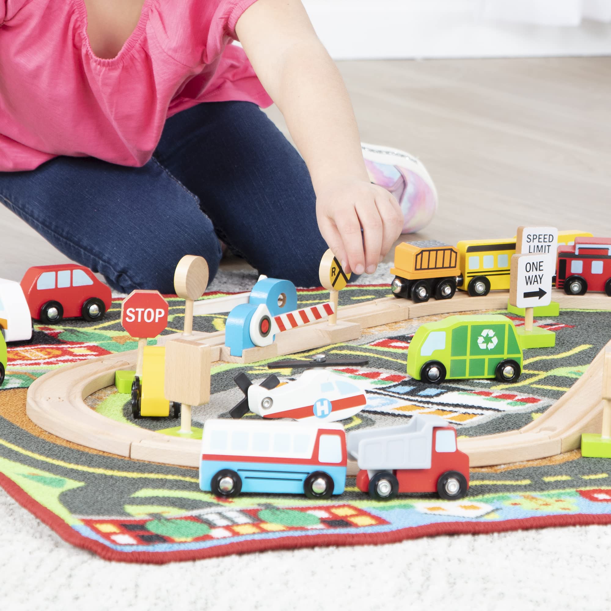 Melissa & Doug Deluxe Multi-Vehicle Activity Rug (39.5" x 36.5") - 19 Vehicles, 12 Wooden Signs, Train Tracks