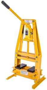 jegs hydraulic shop press | steel with yellow finish | 6-ton | bench top mount | up to 4 1/4-inch working range | includes 2 press plates | lever-action