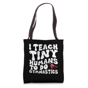 i teach tiny humans to do gymnastics coach funny gymnast tote bag