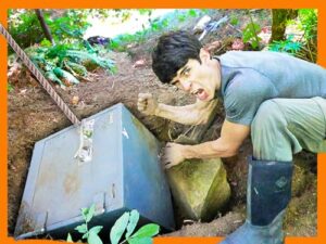 pulling biggest hidden abandoned safe ever out of hole with go-kart