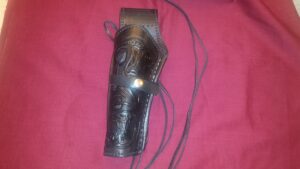 black left handed tooled holster