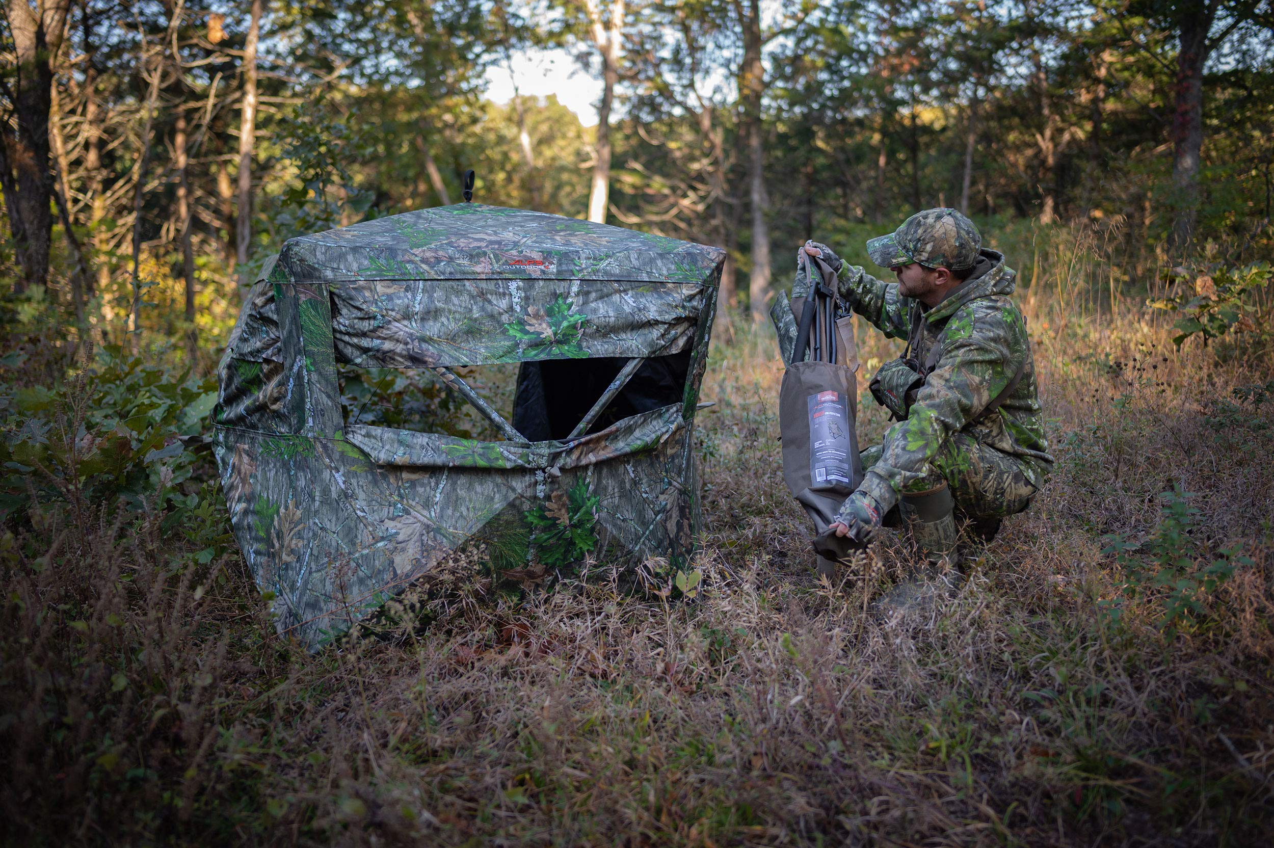 ALPS OutdoorZ Deception Pop Up Hunting Blind Featuring Unique Small Footprint Four Hub Design, Wide Windows with Silent Open, Extra Large Easy Access Door, Mossy Oak Obsession