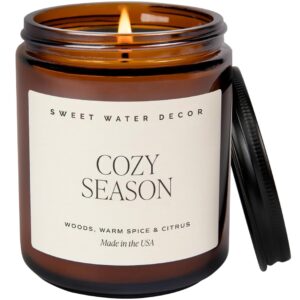 sweet water decor cozy season soy candle | woods, warm spice, and citrus scented candles for home | 9oz amber jar + black lid, 40+ hour burn time, made in the usa | fall and holiday candles for home