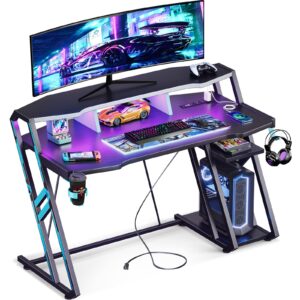 motpk gaming desk with power outlet & led lights, gaming computer desk 47inch with pc storage shelf, gaming table with carbon fiber texture, gamer desk, gift for boys men, black