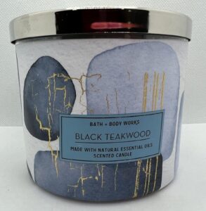 black teakwood 3 wick 14.5 ounce scented candle blue and white with gold accents