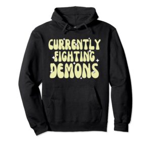 funny currently fighting demons apparel pullover hoodie