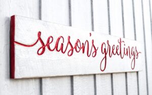 season's greetings sign - carved in a 48"x10" solid wood board | rustic distressed | farmhouse style | festive holiday wall art | christmas decor | handmade in nc