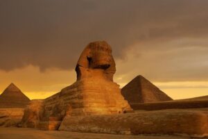 sunset on great sphinx at giza and pyramid complex giza necropolis photo photograph ancient egypt ruins monuments desert landscape cool wall art print poster 36x24