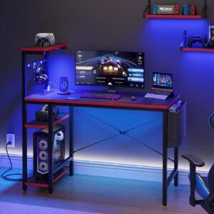 bestier gaming desk with power outlets, 44 inch led gamer desk with 4 tiers reversible shelves, pc gaming table with headset hook & side storage bag for bedroom (black 3d carbon fiber)