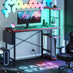 Bestier Gaming Desk with Power Outlets, 44 Inch Led Gamer Desk with 4 Tiers Reversible Shelves, PC Gaming Table with Headset Hook & Side Storage Bag for Bedroom (Black 3D Carbon Fiber)