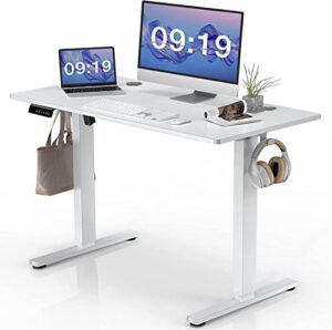 smug standing desk, 48 x 24 in electric height adjustable computer desk for home office, sit stand up work gaming table with memory controller/headphone hook, rising lift workstation-white