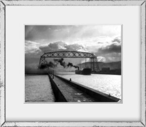 infinite photographs photo: freighter under transporter bridge,canals,cargo ships,duluth,minnesota,mn,c1906