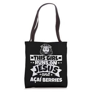 girl runs on jesus and açaí berries tote bag