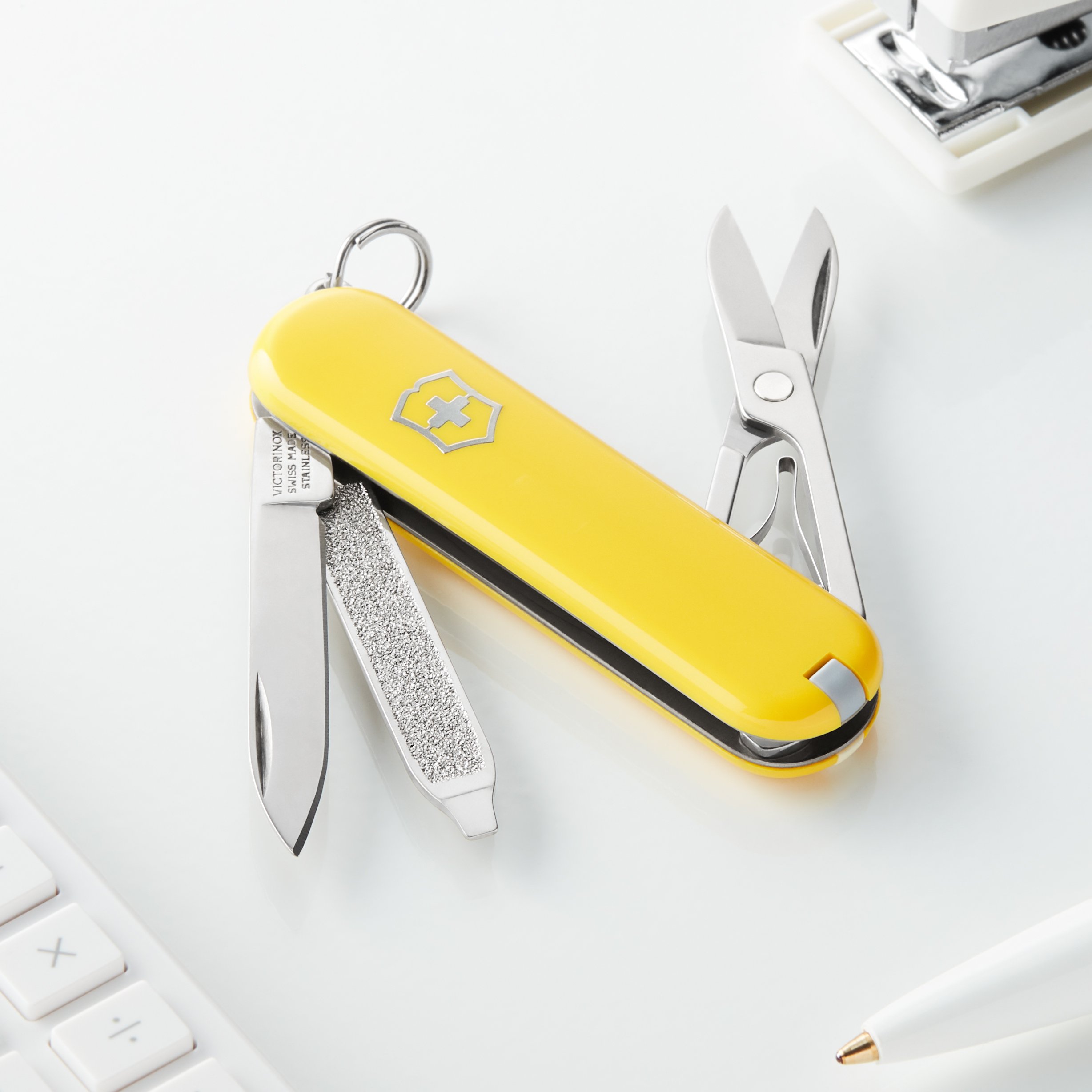 Victorinox Classic SD Swiss Army Knife, Compact 7 Function Swiss Made Pocket Knife with Small Blade, Screwdriver and Key Ring - Sunny Side (Yellow)