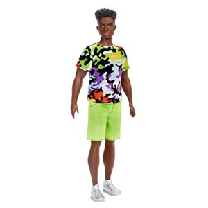 barbie fashionistas ken doll #123, broad with black curly hair wearing multi-colored camo print shirt, neon green shorts & silvery sneakers