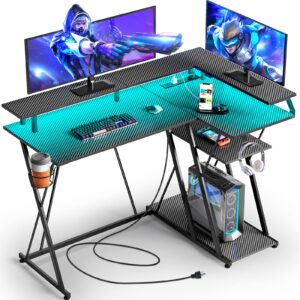 seven warrior l shaped gaming desk with led lights & power outlets, 43” reversible corner desk with storage shelf, computer desk with monitor stand, gaming table with cup holder, with hooks, black