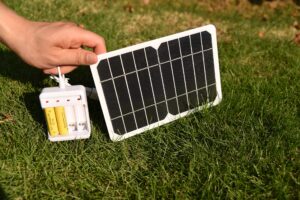 hui yingc solar power charger with 5 watt portable solar panel for 1.2v aa & aaa household rechargeable batteries, with 5 watt solar panel and 4-bay usb aa & aaa charger