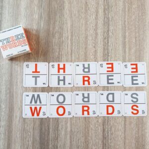 PARTY CRASH GAMES Presents: THREE WORDS OR LESS - A Simple, Yet Challenging Little Word Game; Designed for 2-6 Players 13+ Who are A Clever Wordsmith... 3 WORDS OR LESS