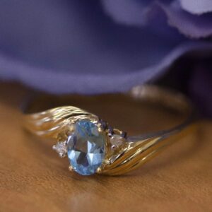 Direct-Jewelry 10k Yellow Gold Oval Blue Topaz And Diamond Ring (Size 7)