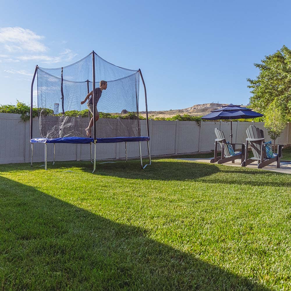 SKYWALKER TRAMPOLINES 10 FT Round, Outdoor Trampoline for Kids with Enclosure Net Basketball Hoop, Spring Pad Cover, ASTM Approval, 700 LBS Weight Capacity