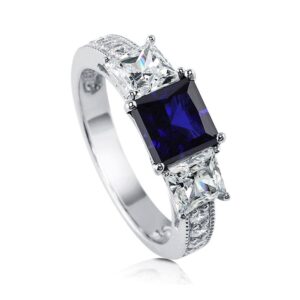 berricle sterling silver 3-stone wedding engagement rings simulated blue sapphire princess cut cubic zirconia cz anniversary promise ring for women, rhodium plated size 7