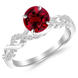 0.63 carat 14k white gold twisting infinity gold and diamond split shank pave set diamond engagement ring with a 0.5 carat natural ruby center (heirloom quality)