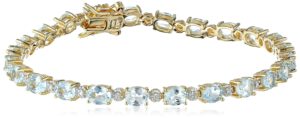 amazon essentials 18k yellow gold plated sterling silver genuine sky blue topaz and diamond accent tennis bracelet, 7.25" (previously amazon collection)