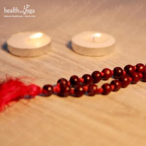 HealthAndYoga™ Rose Wood Mala (108 + 1 Beads with Tassel) & Velvet Bag - Hand Knotted Rosary for Mantra Chanting, Meditation - Invokes Vitality & Courage, Improves Skin Health, Influences Heart Chakra