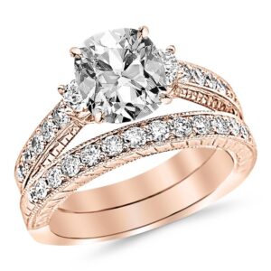 houston diamond district 1.70 carat cushion cut 14k rose gold three stone milgrain & filigree bridal set with wedding band & diamond ring, with a 0.70 carat, e color, vvs2-vs1 clarity center stone